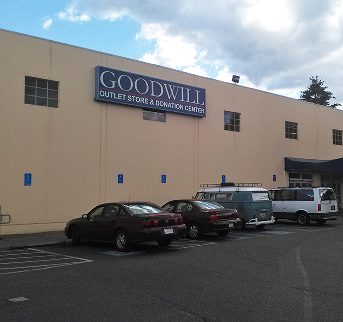 The exterior might not scream "shopping paradise," but seasoned thrifters know it's what's inside that counts. Treasures await beyond that beige facade. 