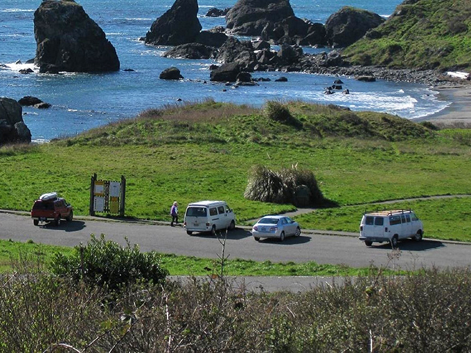 Pull over, you've earned this view. Visitors find the perfect vantage point for witnessing nature's sculptural masterpieces along the shoreline.