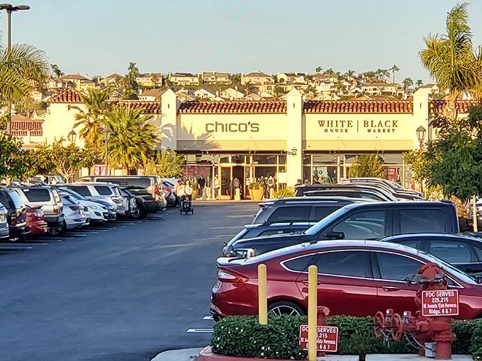 The parking lot at sunset, where Chico's and White House Black Market tempt one last shopping detour before heading home.