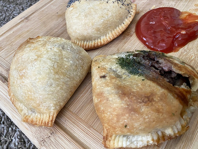 Three golden pasties, one dollop of sauce&mdash;a wooden board presentation that says, "I'm casual, but I still respect you as a food lover."