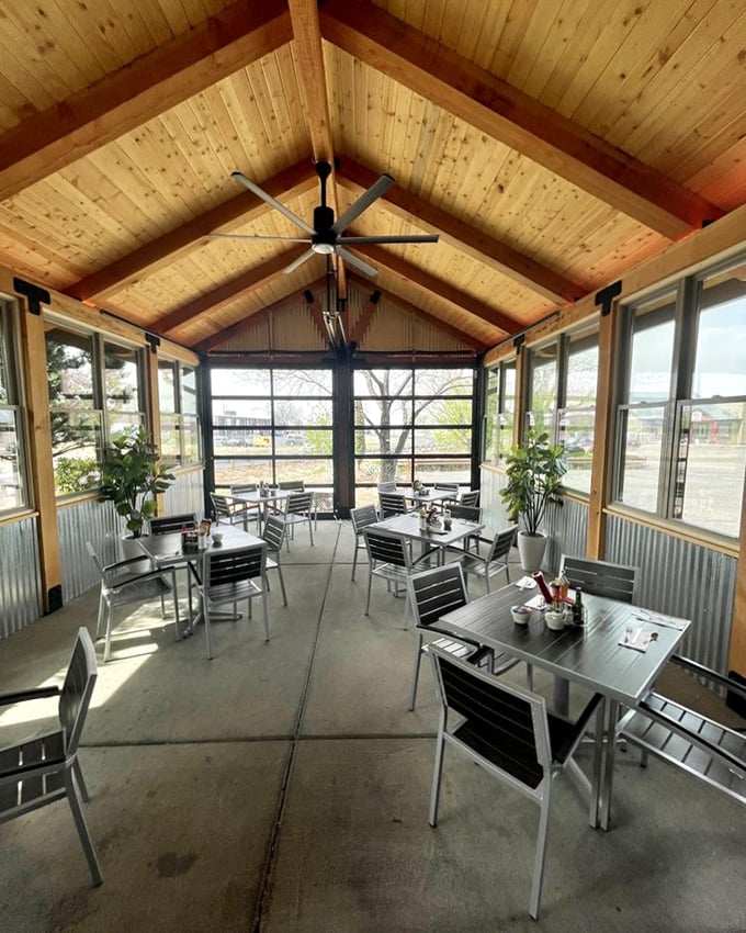 Sunlight streams through this airy patio space, creating the perfect backdrop for coffee, conversation, and contemplating a second cinnamon roll.