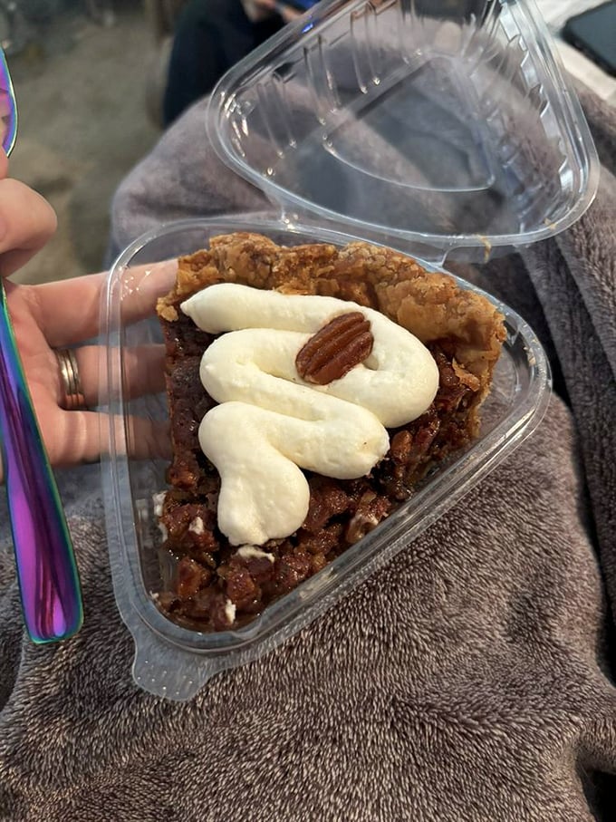 Not just dessert, but a portable slice of pecan pie heaven, complete with whipped cream that's making a very compelling argument against sharing.
