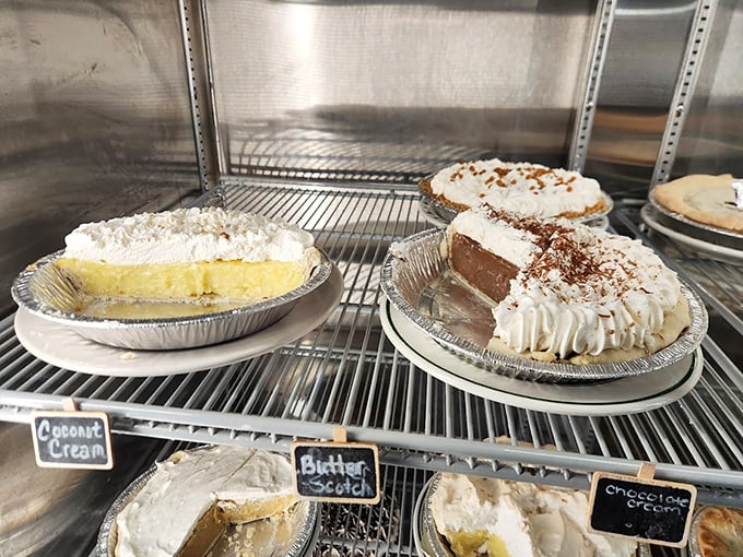 The pie case at Mary B's&mdash;where willpower goes to die. Coconut cream, chocolate cream, and banana cream waiting patiently for your inevitable surrender.