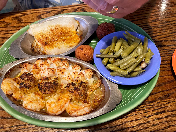 This seafood platter isn't just dinner; it's a maritime celebration where shrimp and fish join forces with perfectly seasoned sides for a plate of pure joy.