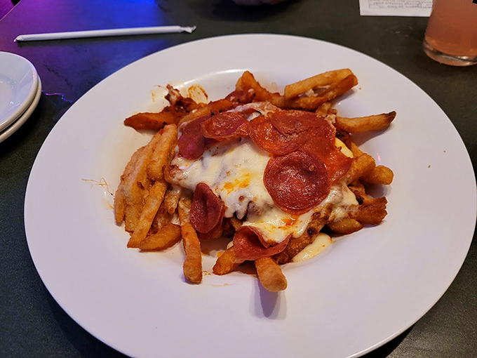 Pizza fries: the dish you didn't know you needed until this very moment. Melted cheese, pepperoni, and fries in perfect harmony &ndash; diet starts tomorrow!
