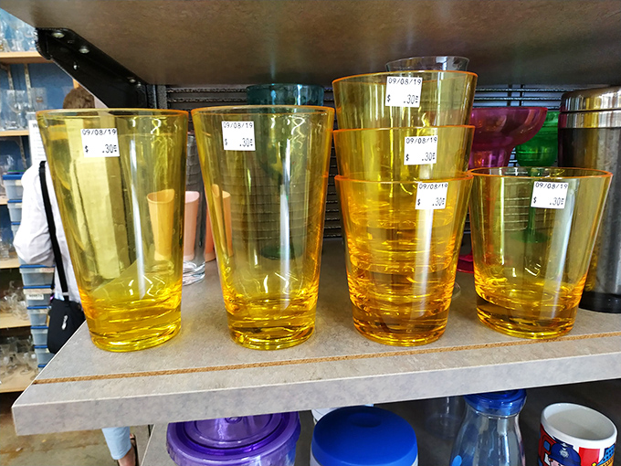 Amber glassware catching light like liquid sunshine&mdash;perfect for elevating backyard barbecues from paper cup casual to vintage chic.