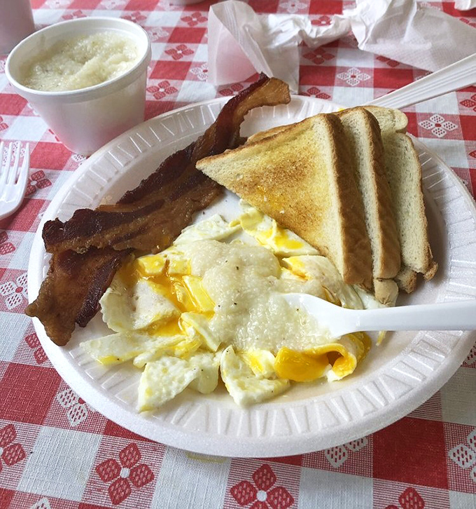 The breakfast trinity: perfectly scrambled eggs, crispy bacon, and golden toast. Simplicity executed with the confidence that comes from decades of practice.