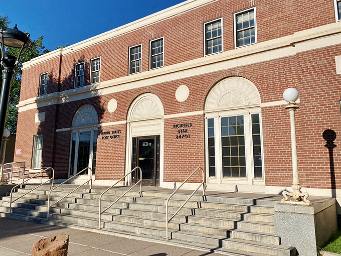 The post office: where mail gets delivered and impromptu community meetings happen between the stamp machine and the bulletin board.