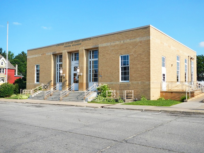 The stately Post Office building stands as a civic anchor, its warm yellow brick and symmetrical design reflecting an era when public architecture inspired community pride.