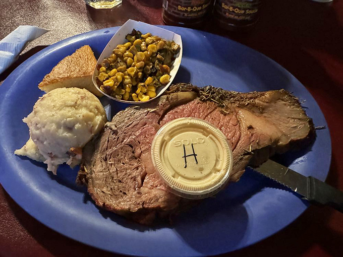 Prime rib that's been kissed by smoke and treated with respect. The mashed potatoes and corn look like worthy companions.