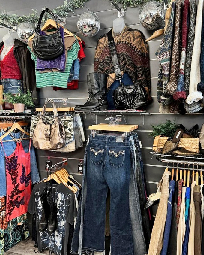 Disco balls and denim&mdash;this display wall combines vintage vibes with modern styling for the ultimate thrift store aesthetic.