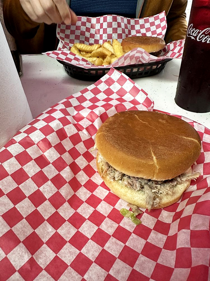 A pulled pork sandwich so honest and unpretentious it makes you question why anyone would ever complicate barbecue with unnecessary frills.