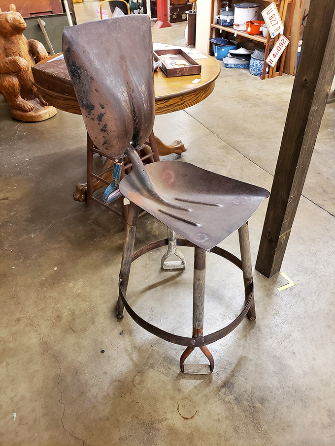 Not just a chair – a conversation piece crafted from repurposed farm tools that somehow looks more comfortable than my expensive office chair.