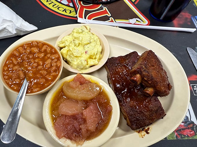 These ribs wear their smoke ring like a badge of honor, glistening with sauce that'll haunt your dreams.