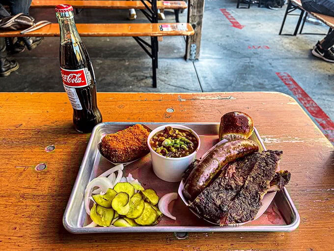 Meat and metal tray &ndash; a timeless romance. This BBQ plate with ribs, sausage, and pickles is San Francisco's answer to Texas dreams.