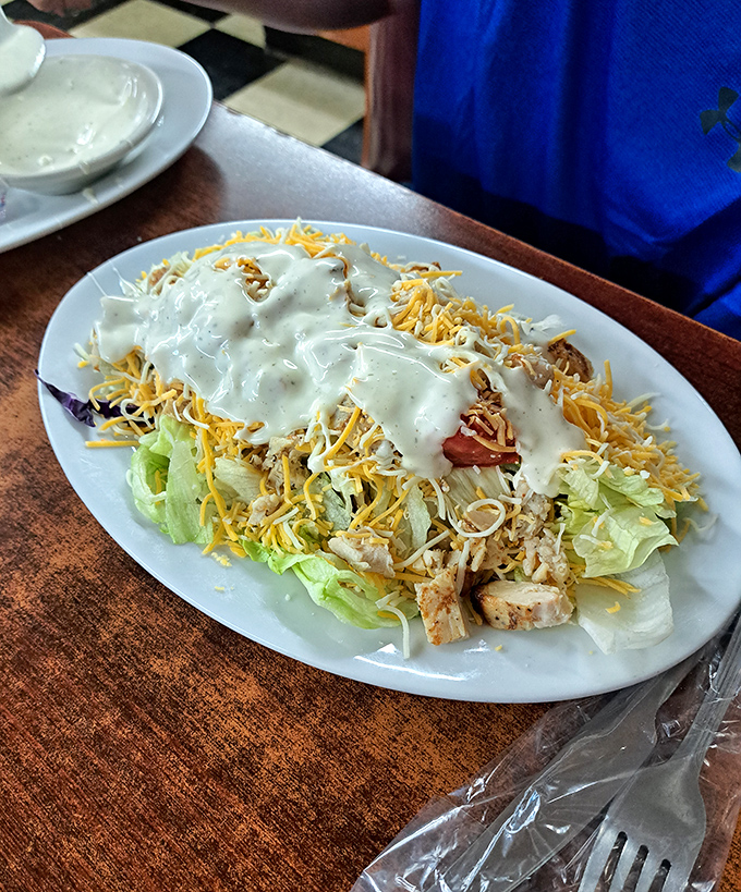 Sometimes simplicity wins: fresh greens, grilled chicken, cheese, and dressing that doesn't overthink the assignment.