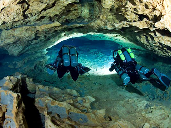 The underwater explorers' ultimate playground &ndash; cave divers illuminate limestone passages shaped by millennia of flowing water.