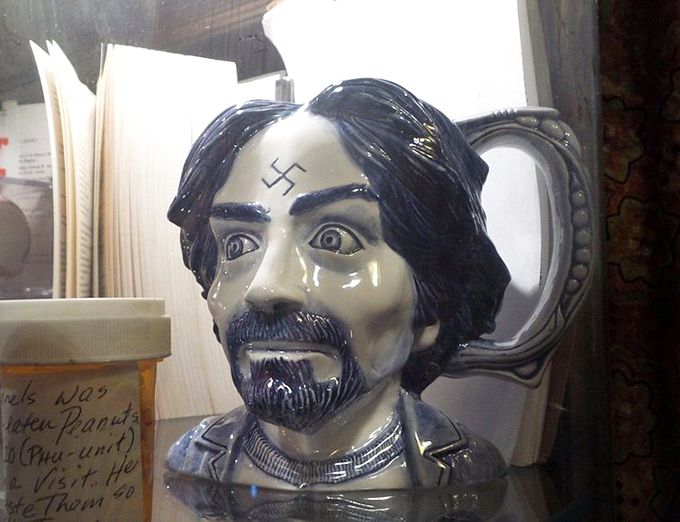 This ceramic bust with a swastika forehead marking represents one of history's most notorious killers—chilling in its craftsmanship.