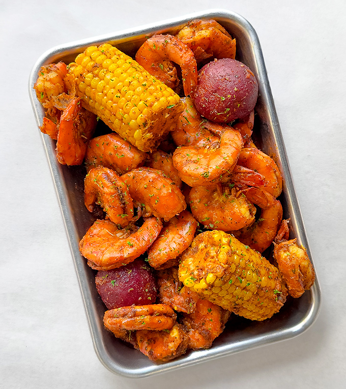 This seafood boil looks like a treasure chest opened after years at sea, revealing buttery, spicy gold.