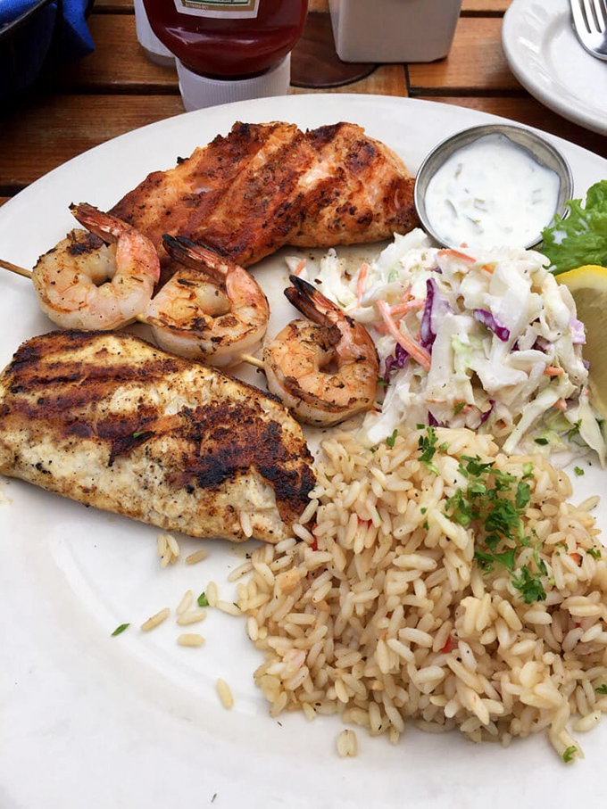 Mesquite-grilled perfection on a plate—fish, shrimp, and sides that make you wonder why you ever eat anything else.