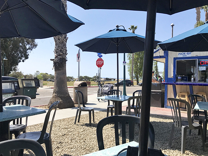 The outdoor seating area where surfers, locals, and tourists become equals united by burger love.