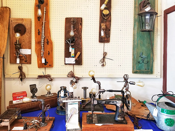 Repurposed tools become artistic wall sconces alongside vintage sewing machines&mdash;industrial history transformed into decorative conversation pieces.