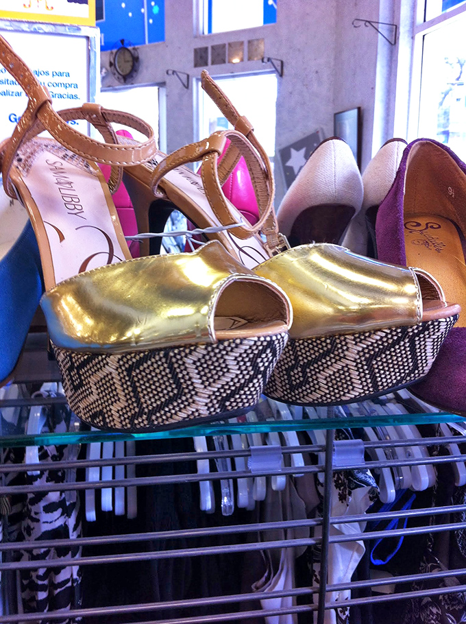 Golden platforms that scream "disco revival" nestled between sensible flats—the footwear section tells San Francisco's story.