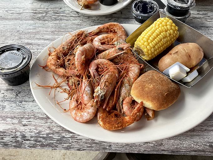 Fresh Gulf shrimp piled high with corn and potatoes proves that sometimes the simplest presentations pack the most flavor and satisfaction.