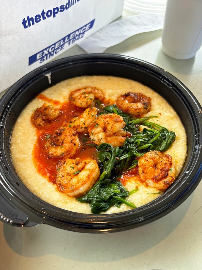 Plump shrimp lounging on a bed of creamy grits with spinach playing chaperone&mdash;a Southern classic that found its way north and decided to stay permanently.
