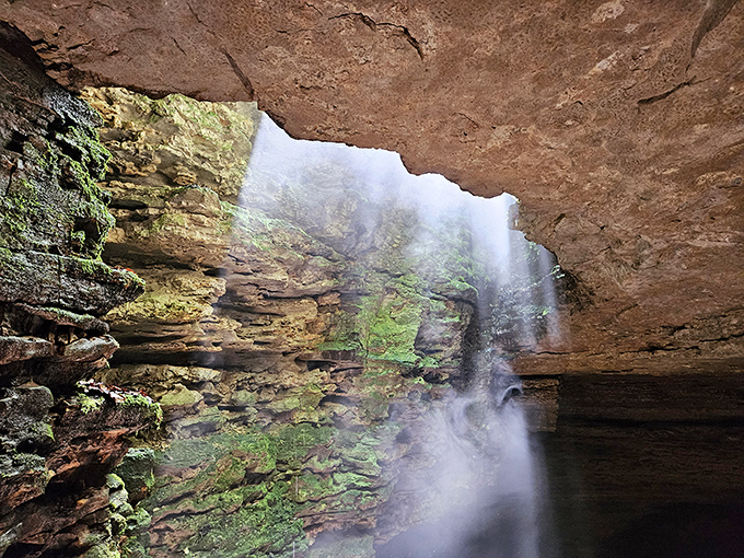 Sunlight pierces the darkness, creating a heavenly spotlight on the cave's dramatic staircase. Indiana Jones would approve.