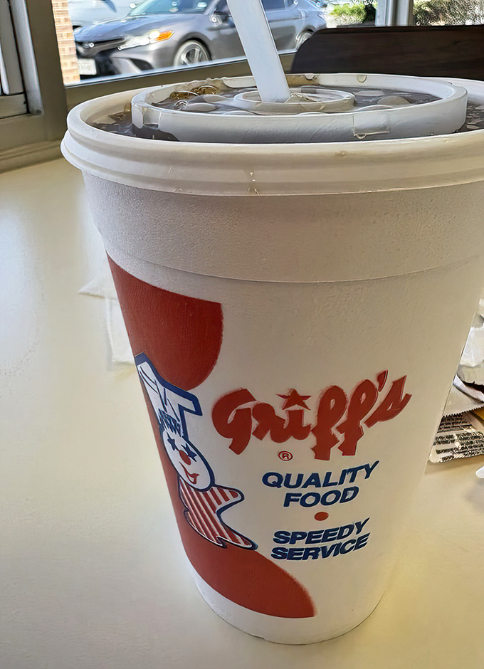 The cup says "Quality Food, Speedy Service"—the unofficial Texas pledge of allegiance for burger aficionados everywhere.