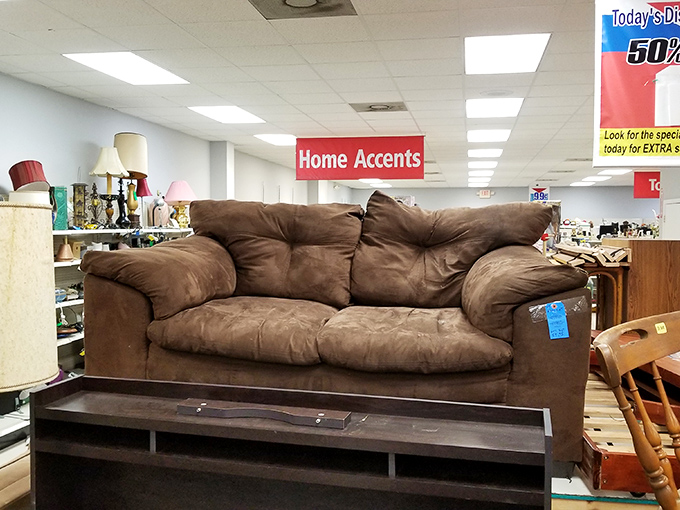 That brown sofa has stories to tell. With a throw pillow and good book, it's ready to become your new afternoon nap headquarters.