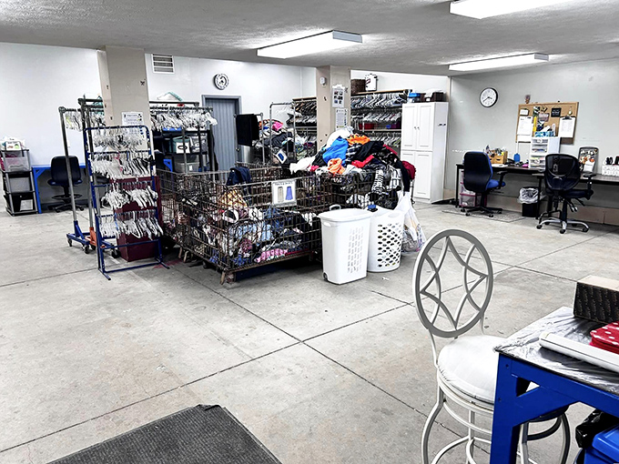 The clothing sorting area resembles a well-organized backstage at Fashion Week, if Fashion Week celebrated everyday wearable history.