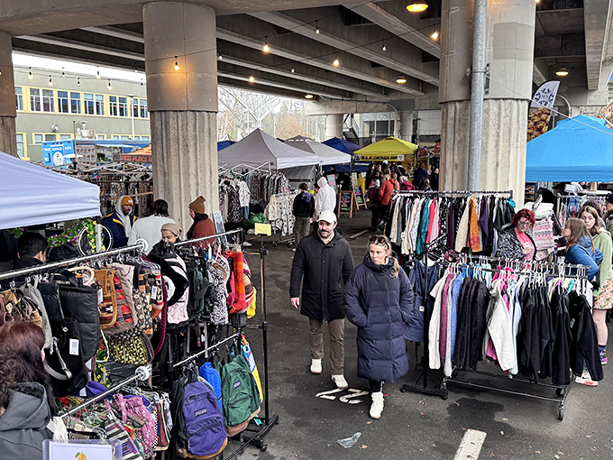 Under the concrete canopy, vendors create miniature boutiques. The covered section offers weather protection and the unmistakable thrill of the hunt.