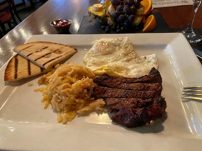 Breakfast meets dinner in this glorious rebellion against mealtime norms. A perfectly seared steak with sunny-side-up eggs is comfort food elevated to an art form.