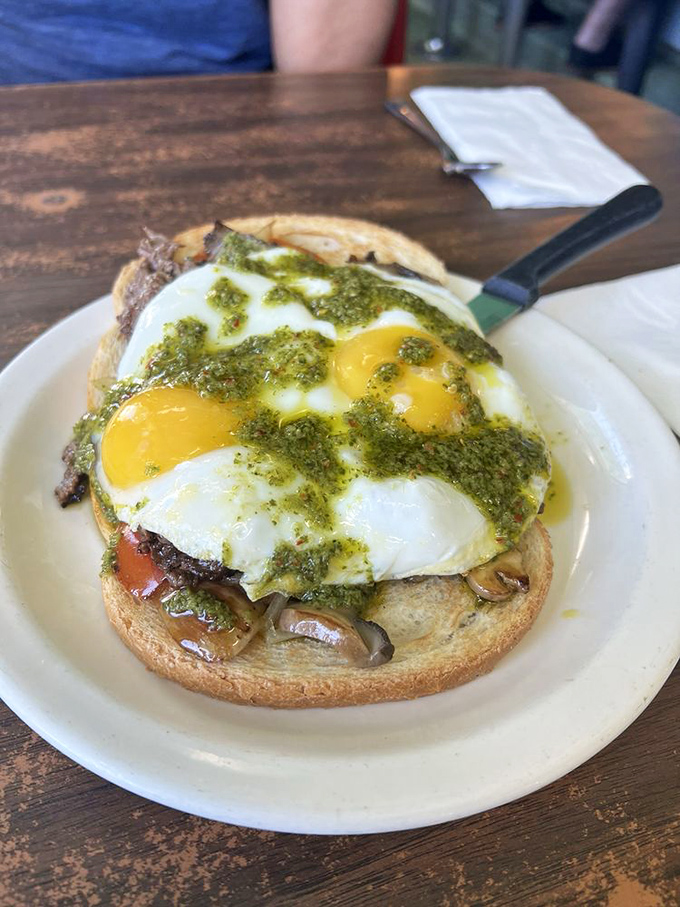 Open-faced breakfast perfection with a vibrant pesto that says, "Yes, California influence has arrived, but we're keeping it real."