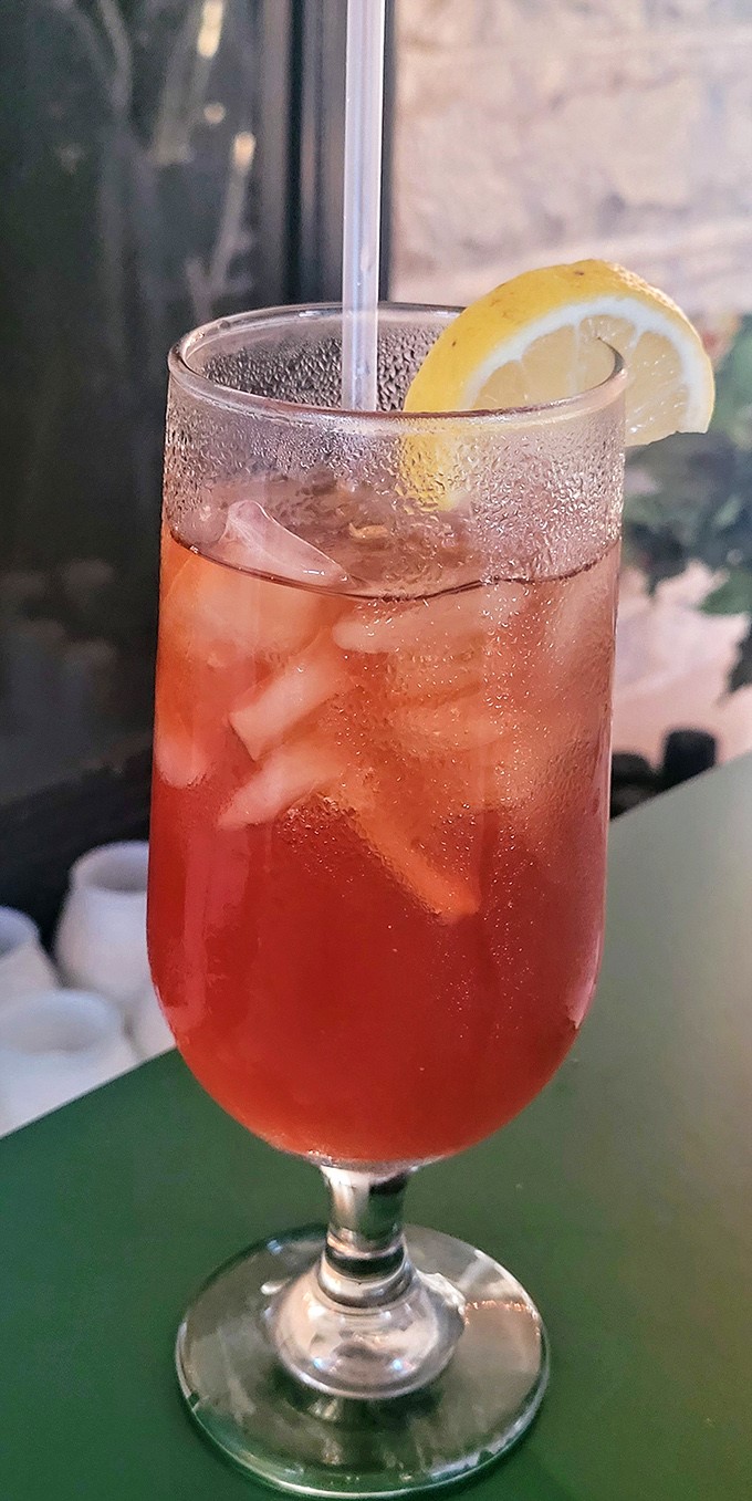 This isn't your childhood lemonade stand's creation—it's a grown-up strawberry refresher that whispers "summer" even in the depths of Wisconsin winter.