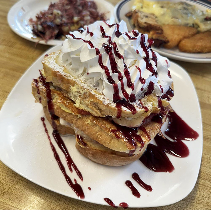 This berry-topped French toast stack isn't just breakfast &ndash; it's an architectural achievement worthy of its own parade down Main Street.