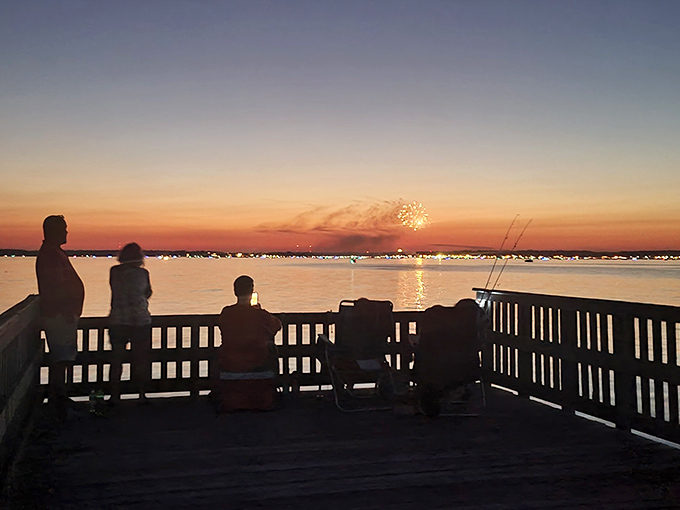 Silhouettes against a painted sky prove that some moments are worth staying up late.