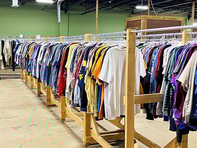 More t-shirts than a rock concert merch table. The wooden racks groan under the weight of a thousand casual Fridays waiting to happen.