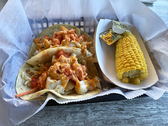 Fish tacos with corn on the side because sometimes you need vegetables to justify your seafood indulgence.