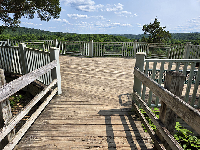 This wooden deck isn't just a viewing platform—it's nature's balcony seat to one of Missouri's greatest shows.