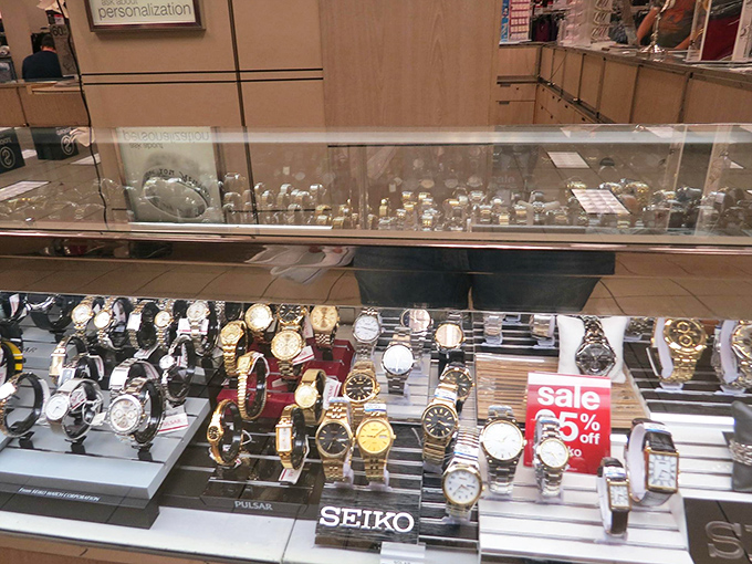 Watches gleam under display lights, each one promising to make you fashionably late in style.