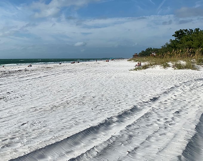 Tire tracks in paradise? Even the beach maintenance crew must pause occasionally to appreciate what most people save all year to visit.