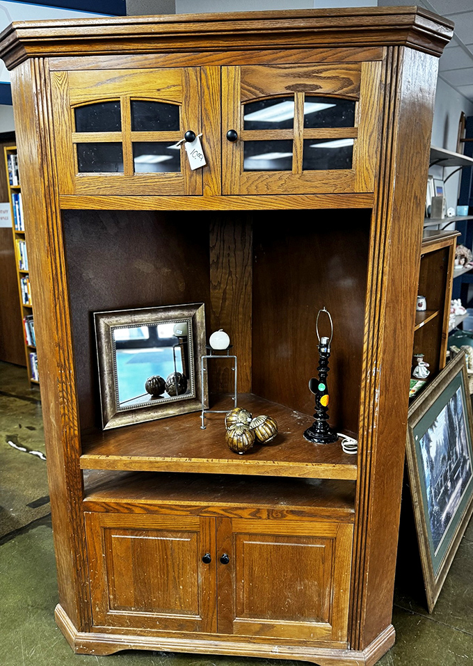 This isn't just furniture—it's a time machine. This oak hutch has probably witnessed more family dinners than your favorite sitcom's dining room table.