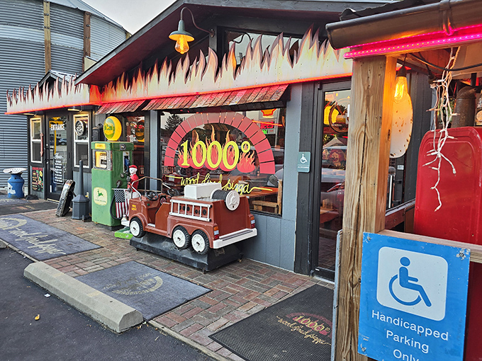 Flames painted along the roofline aren't just decoration &ndash; they're a preview of the wood-fired magic happening inside 1000&deg; Pizza.