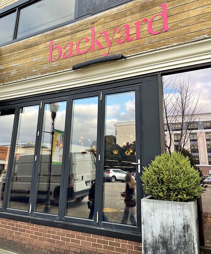 Modern wood facade brings contemporary style to downtown dining while promising innovative pizza experiences within.