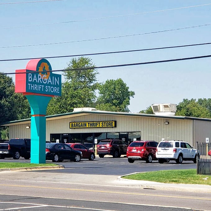 Bargain Thrift Store's cheerful teal sign stands out like a tropical oasis in a desert of retail sameness.