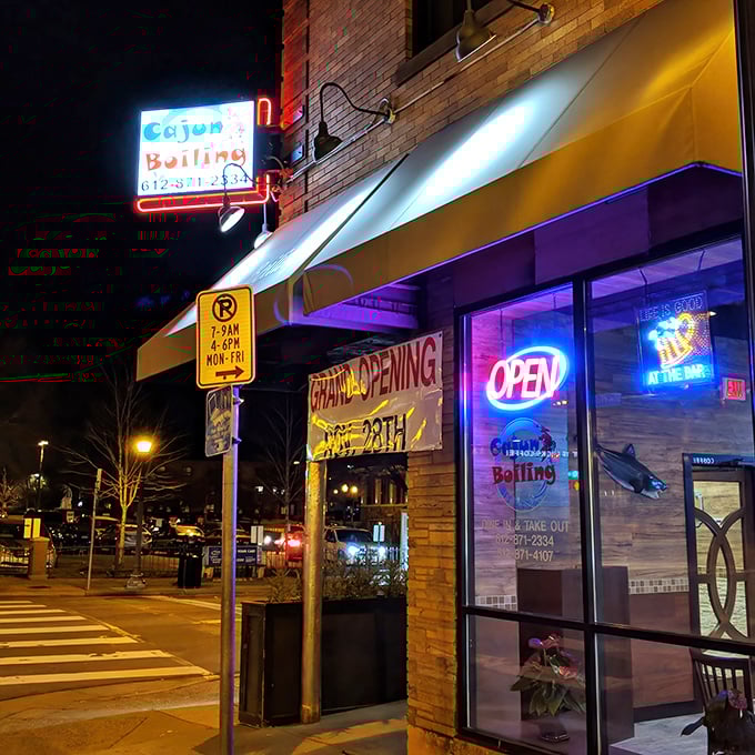 That neon "OPEN" sign and colorful storefront practically shout "come get messy with some shellfish tonight!"