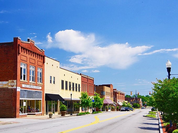 Historic buildings frame Clinton's main thoroughfare, where college-town energy meets small-town housing prices in perfect harmony.